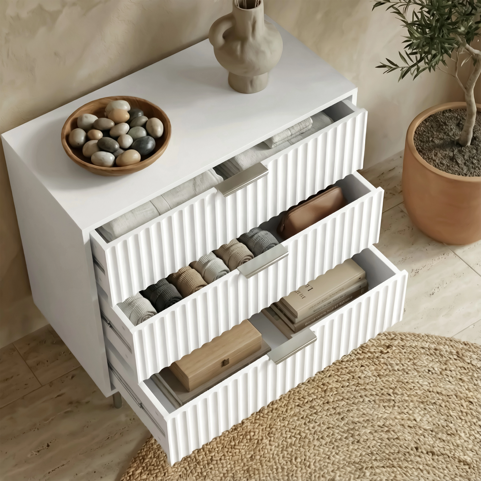 [White] Flutrina 3 drawer chest with all drawers stepped open showing ...